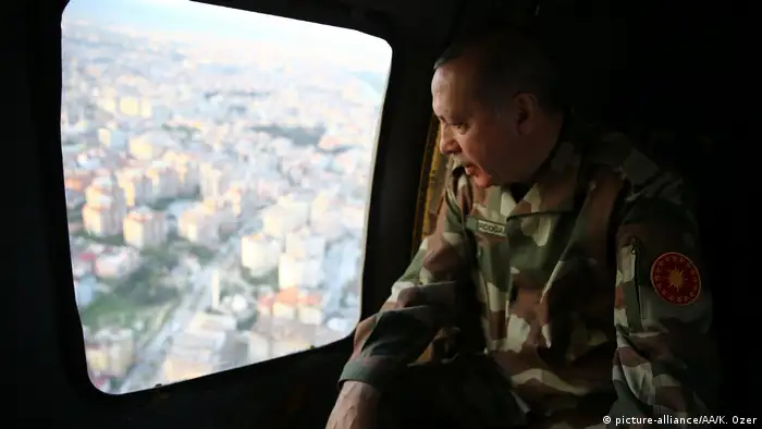 Erdogan in military uniform in a helicopter