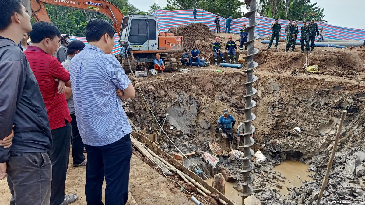 Vietnam rescuers race to free boy stuck in building shaft