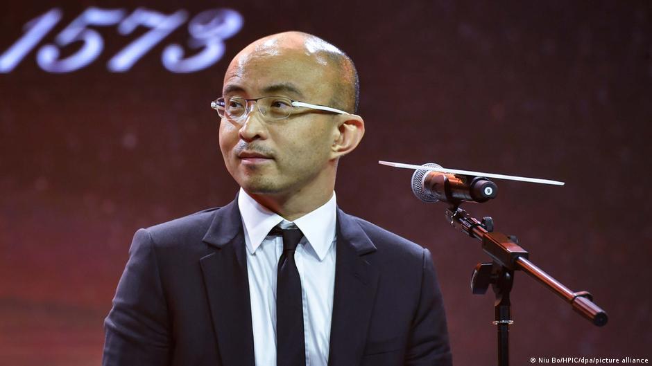 Missing Chinese billionaire aiding in probe, company says