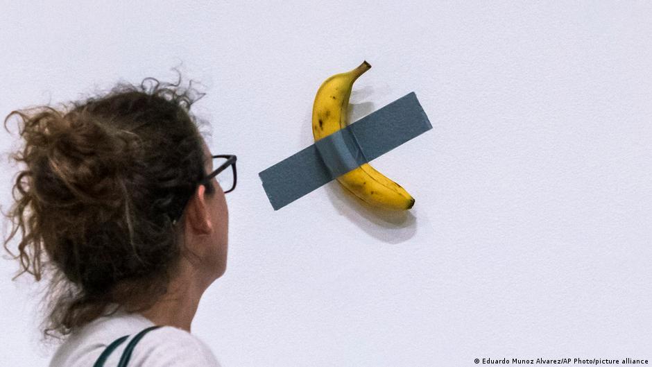 Banana taped to wall sells for $6.2 million at art auction – DW – 11/21 ...