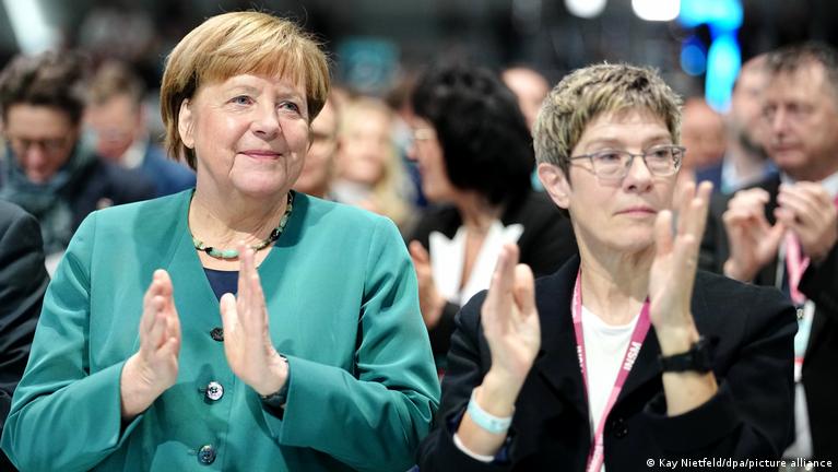 Germany news: Merkel urges patience for Merz's coalition