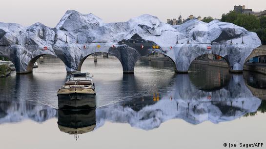 Christo-like art project turns Parisian bridge into cave